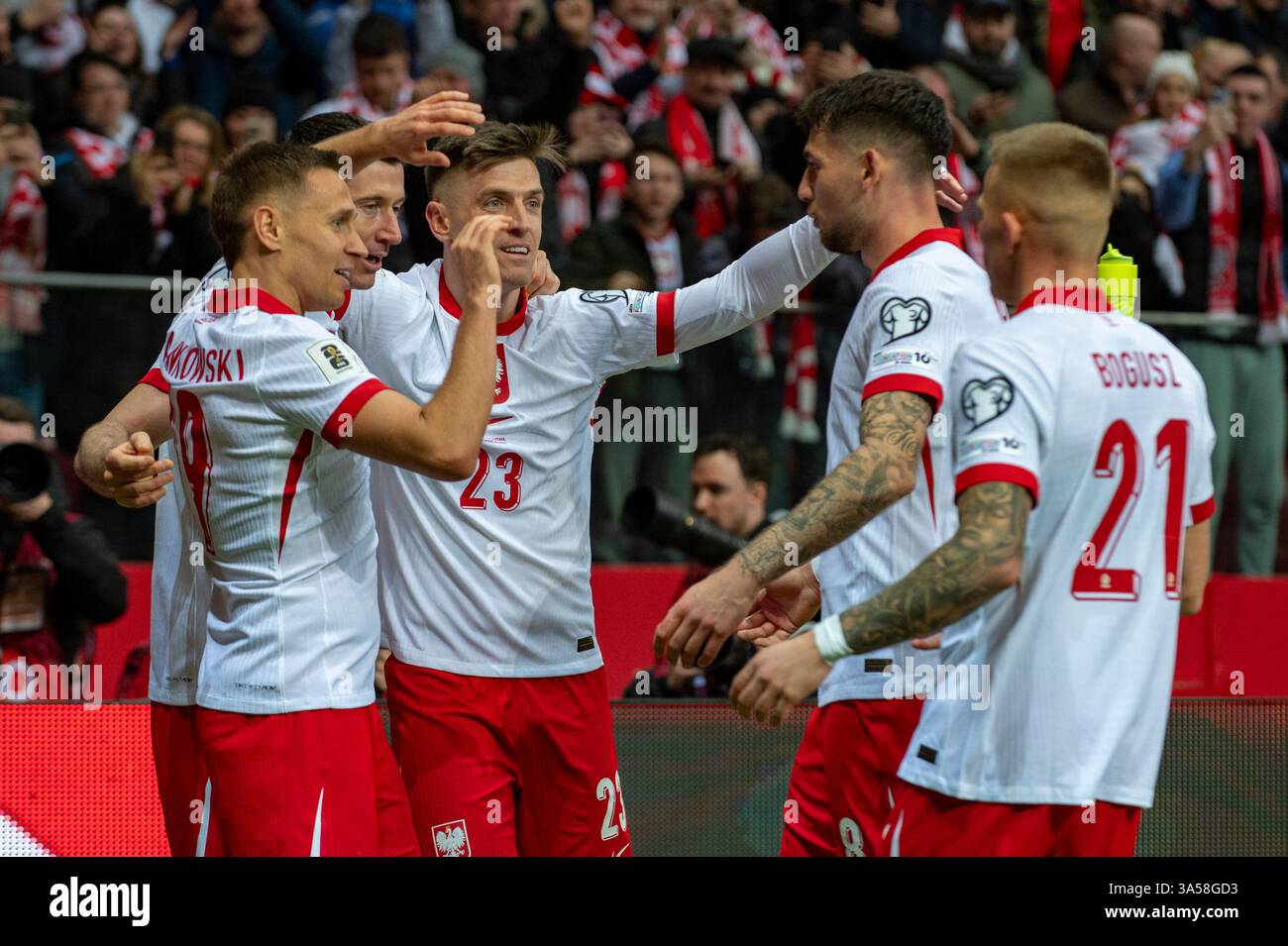 Robert Lewandowski of Poland celebrates scoring with team mates during ...