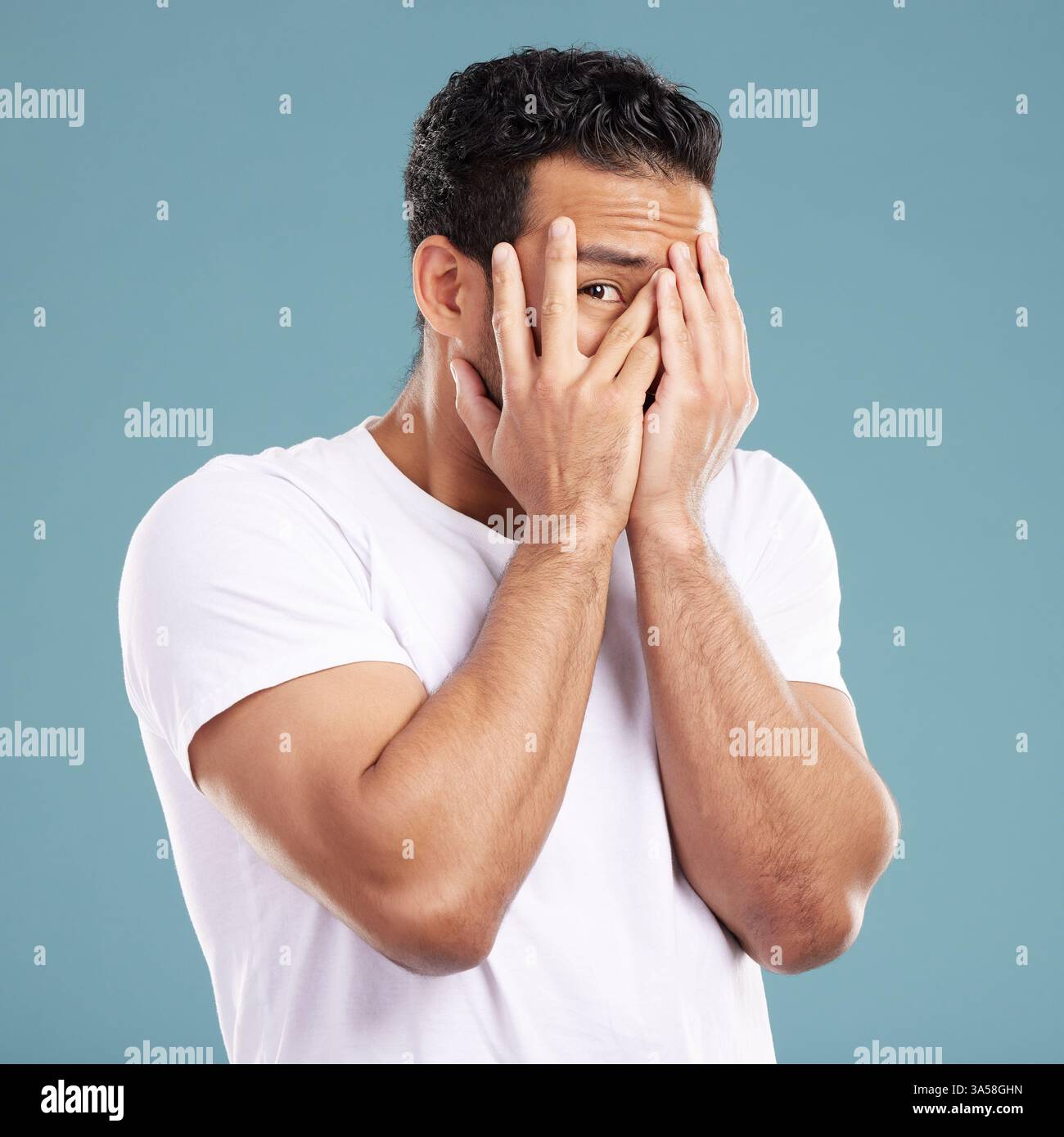 Man, shame and hide face in studio for regret, embarrassed and ...