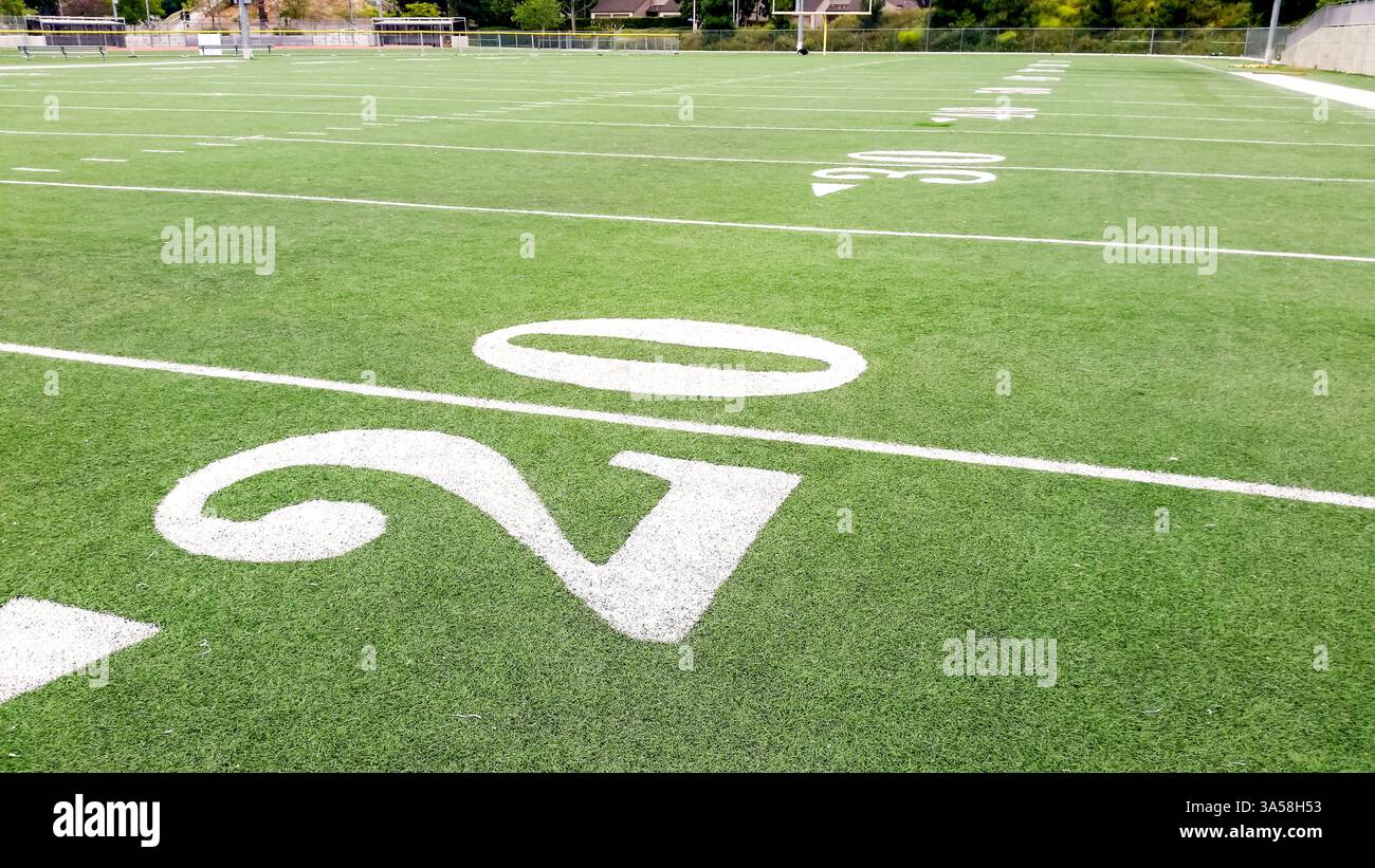 A view of the yard numbers on a football field, featuring the 20 yard ...