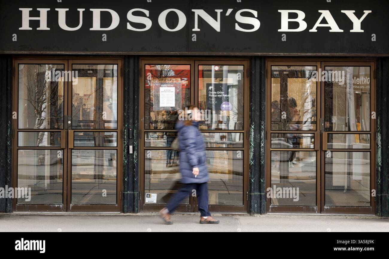A pedestrian passes the Hudson's Bay store in downtown Calgary, Alberta ...