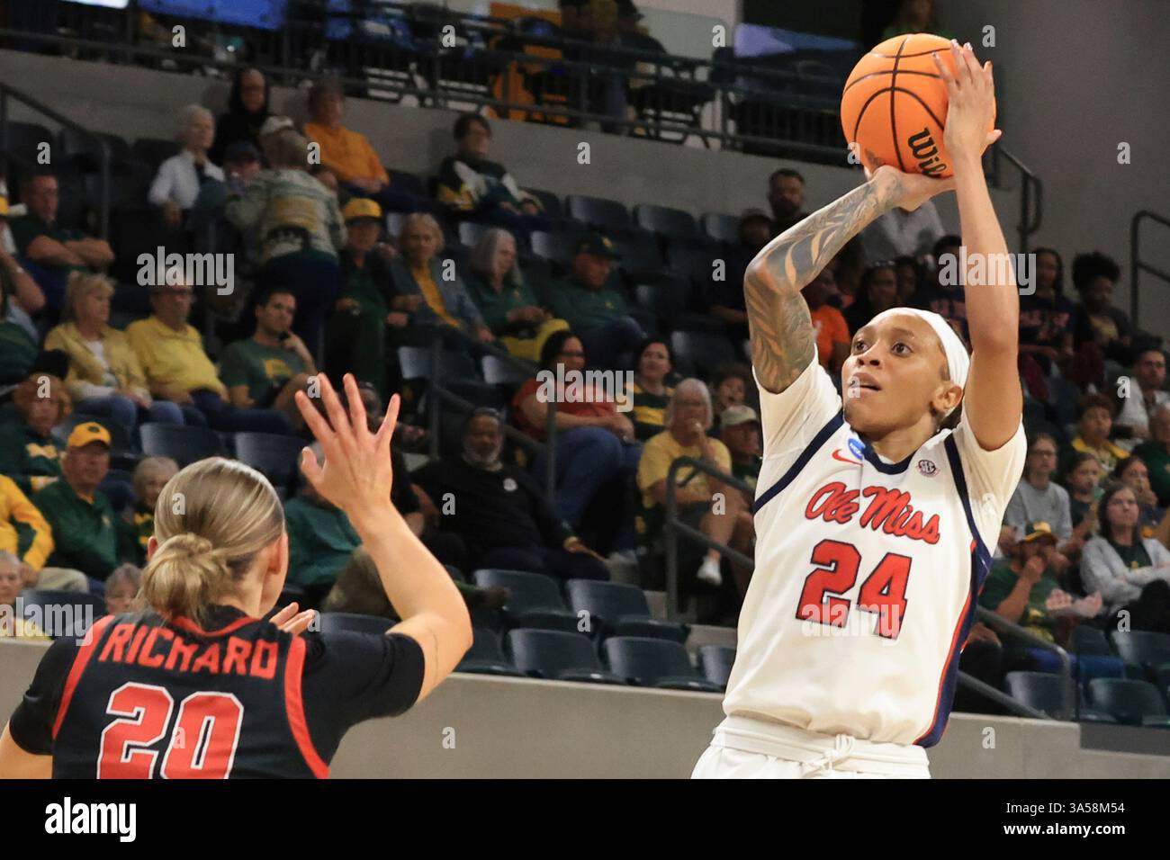 Ole Miss forward Madison Scott shoots over Ball State Alex Richard ...