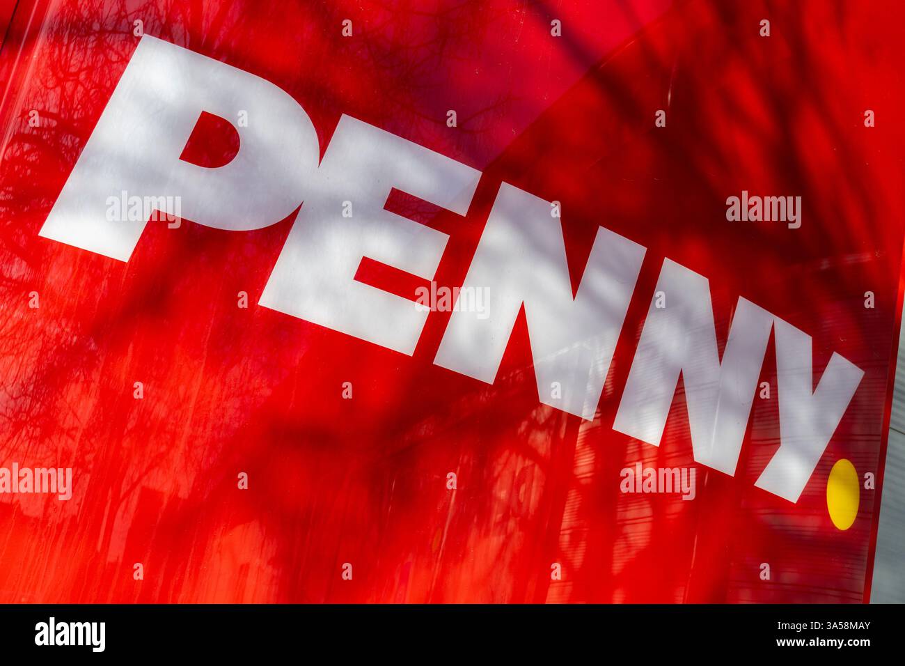 Large red sign features the word penny in bold white letters. The ...