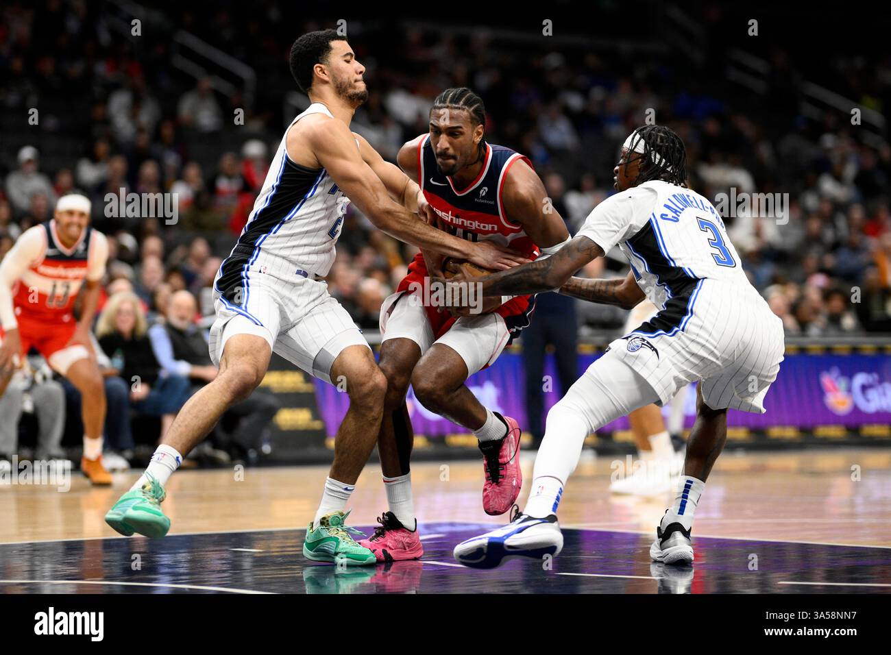 Orlando Magic guards Caleb Houstan, left, and Kentavious Caldwell-Pope ...