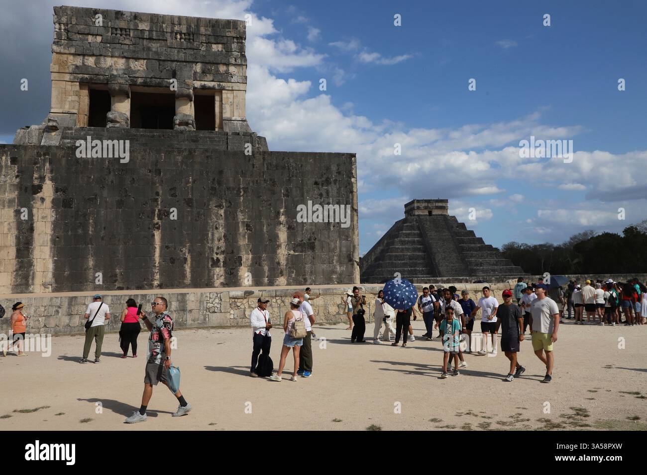 Tourists visit the Mayan ruins of Chichen Itza, Mexico, during the ...