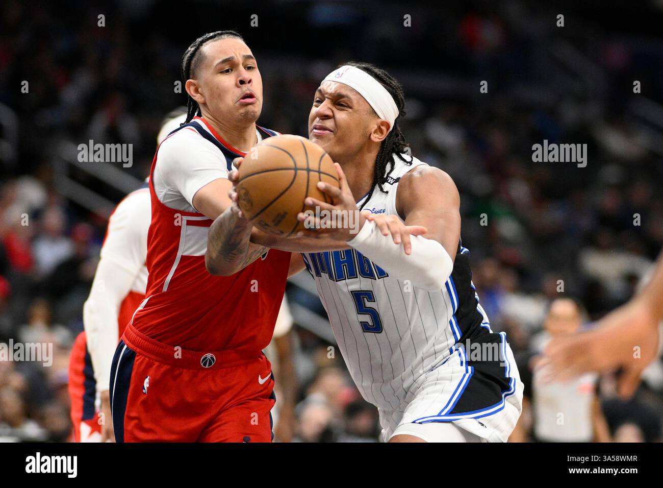 Washington Wizards forward Kyshawn George, left, fouls Orlando Magic ...