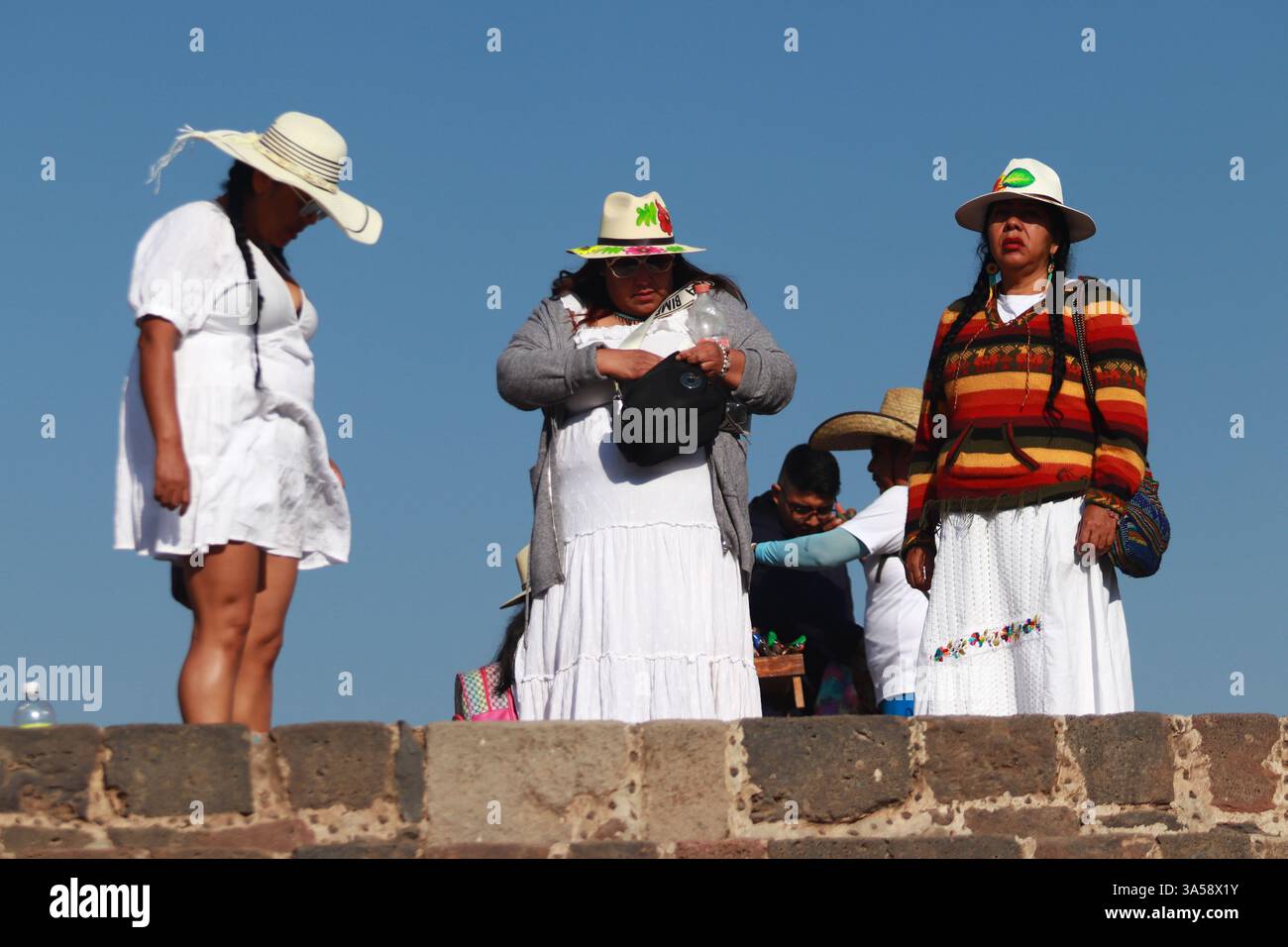 People attend the Pyramid of the Sun to welcoming of spring equinox at ...