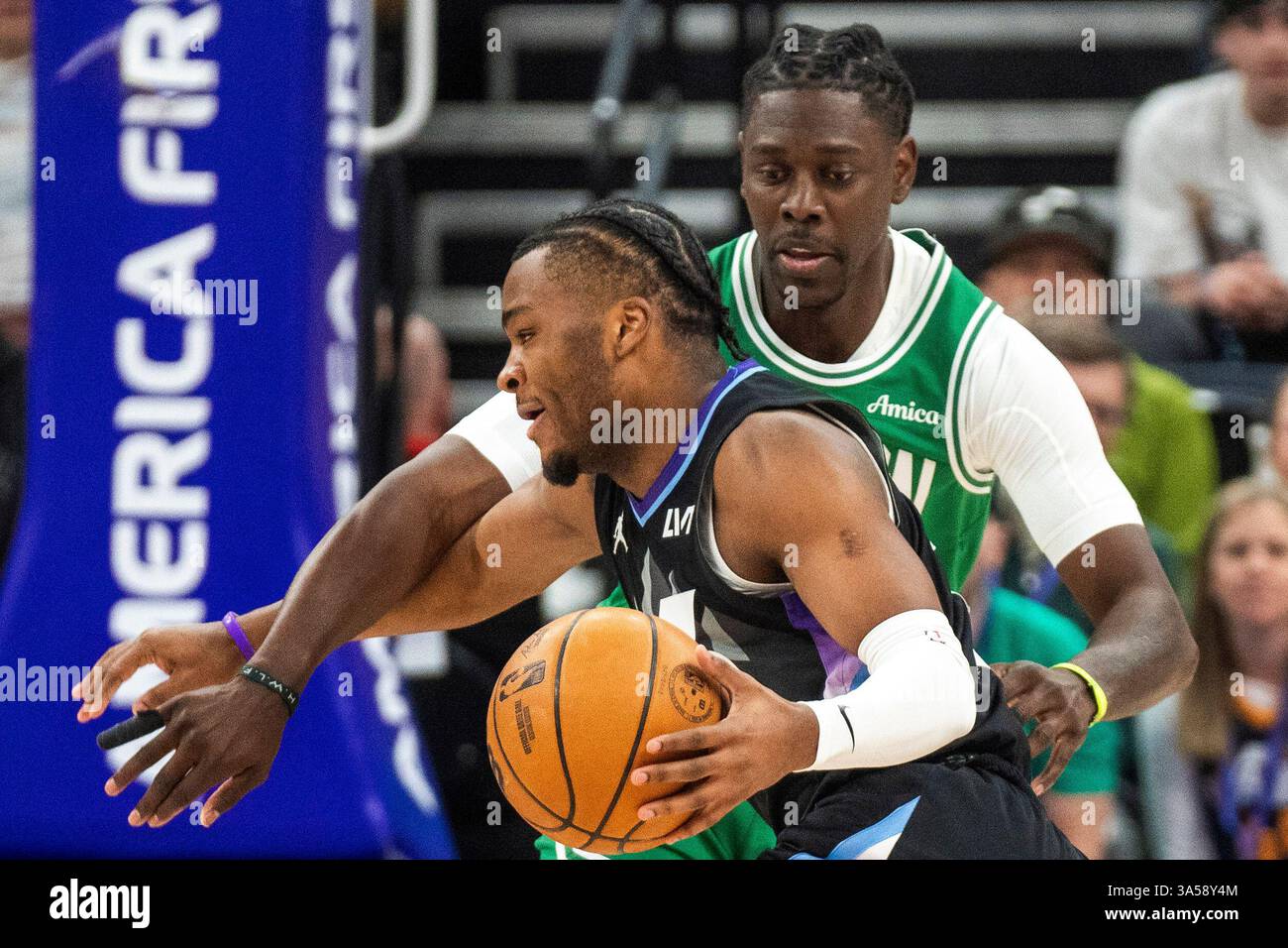 Utah Jazz guard Isaiah Collier, left, is guarded by Boston Celtics ...