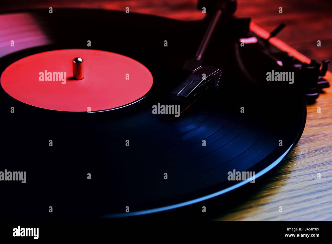 Turntable with vinyl record, closeup. Color toned Stock Photo - Alamy