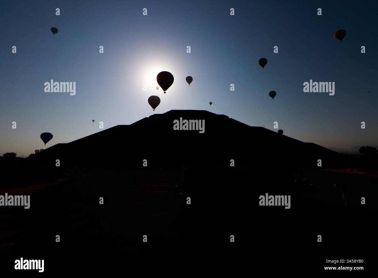 Balloons fly over the Pyramid of the Sun during the welcoming of spring ...
