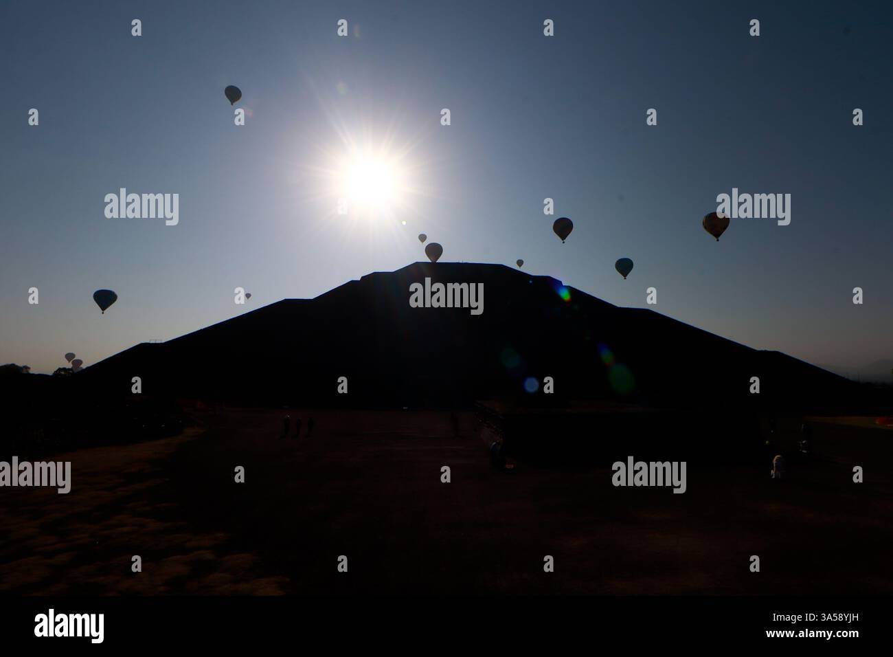Balloons fly over the Pyramid of the Sun during the welcoming of spring ...
