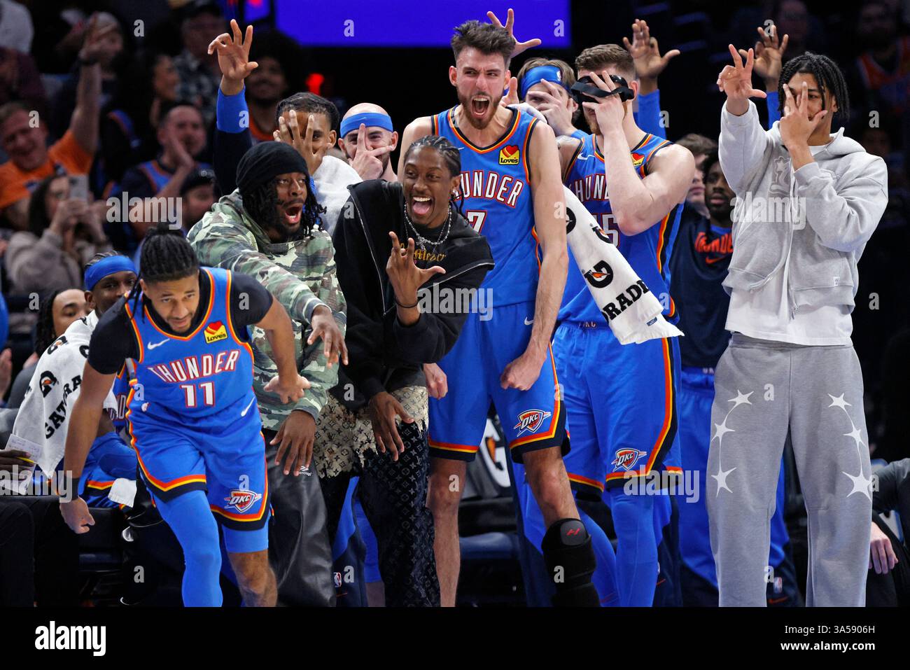 The Oklahoma City Thunder bench reacts after Thunder guard Isaiah Joe ...