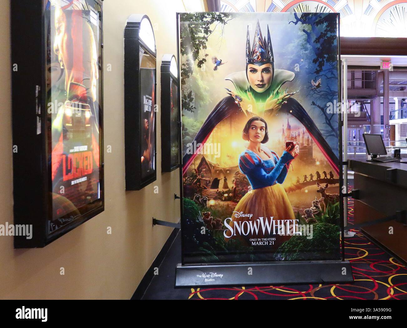Promotional signs for Disney's Snow White are on display at an IMAX ...