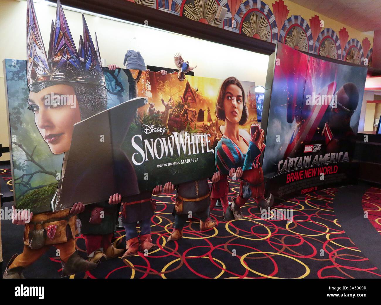 Promotional signs for Disney's Snow White are on display at an IMAX ...