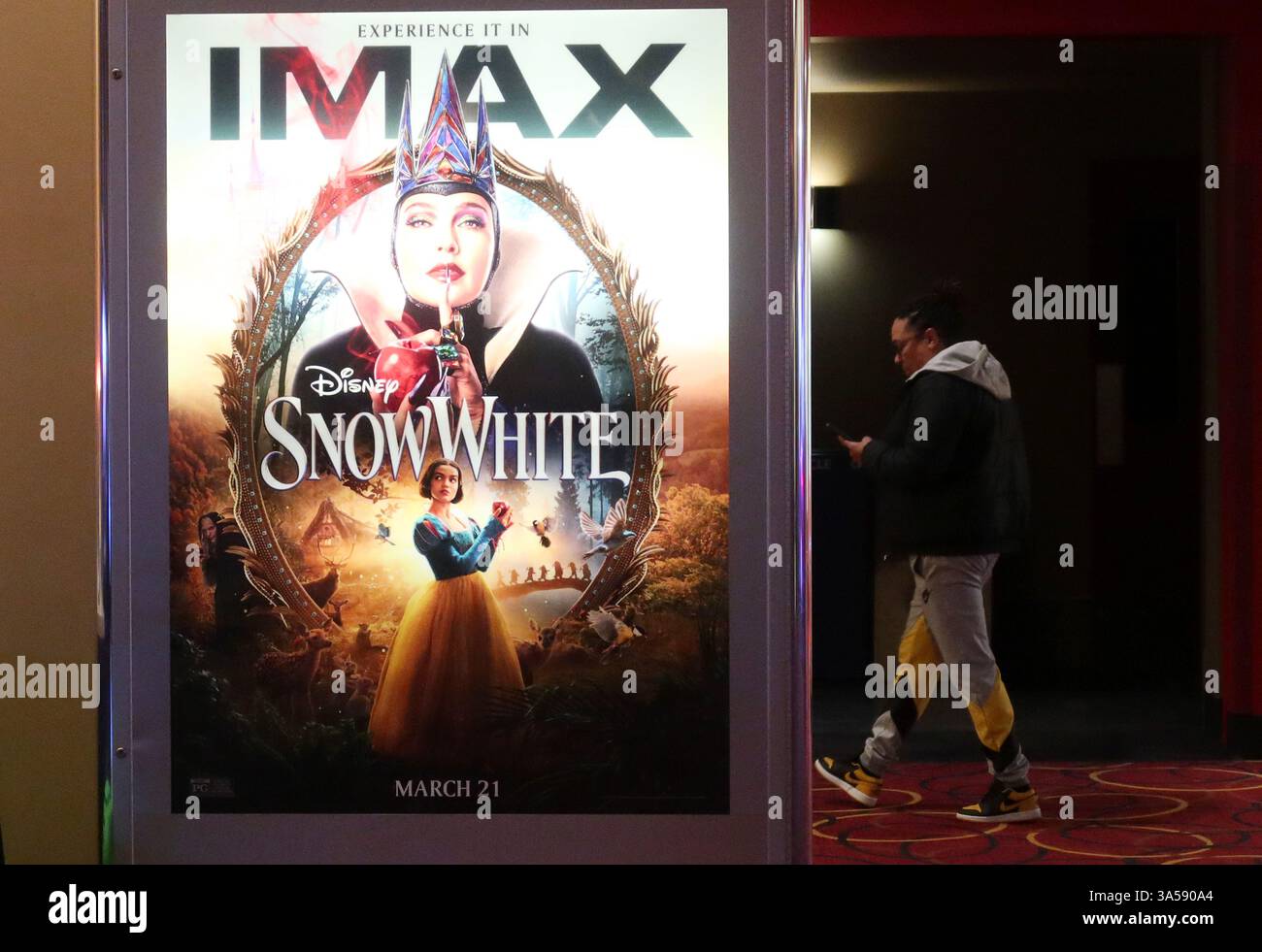 Promotional signs for Disney's Snow White are on display at an IMAX ...