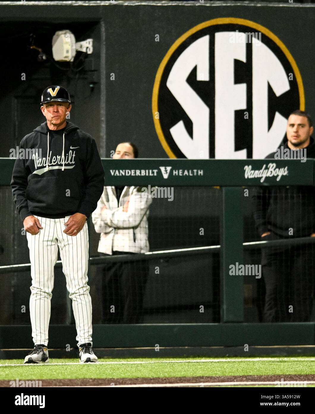 Nashville, Tennessee, USA. 21st Mar, 2025. Tim Corbin watches on during ...