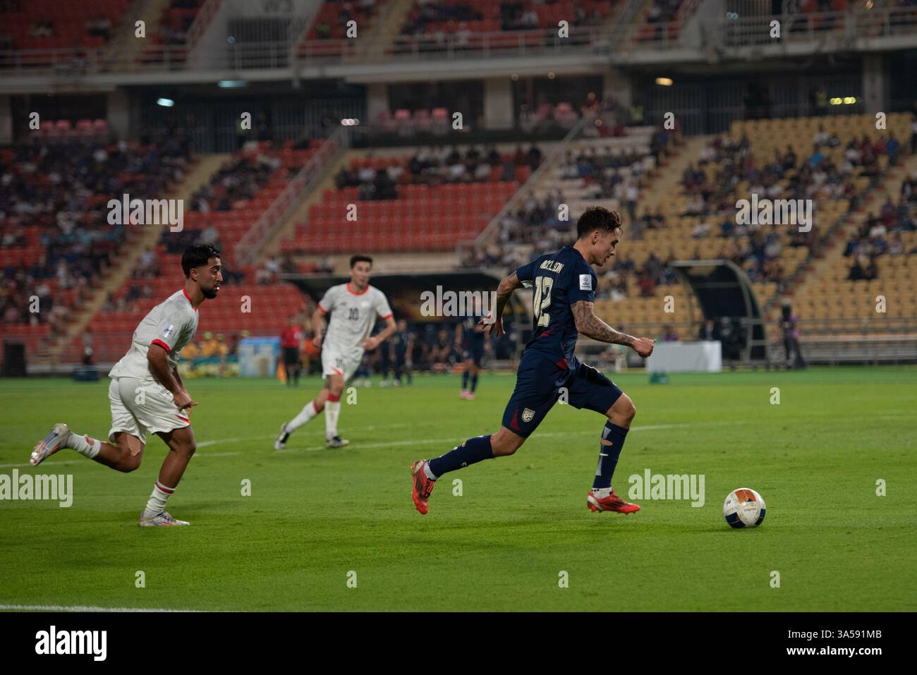 LOOK SAA NICHOLAS KENGKHETKID MICKELSON #12 of Thailand(blue), controls ...