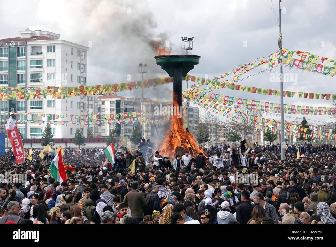 A fire is lit during the Newruz celebration. The final celebration of ...