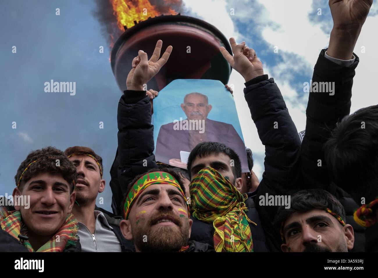 Diyarbakir, Turkey. 21st Mar, 2025. People gesture during the ...