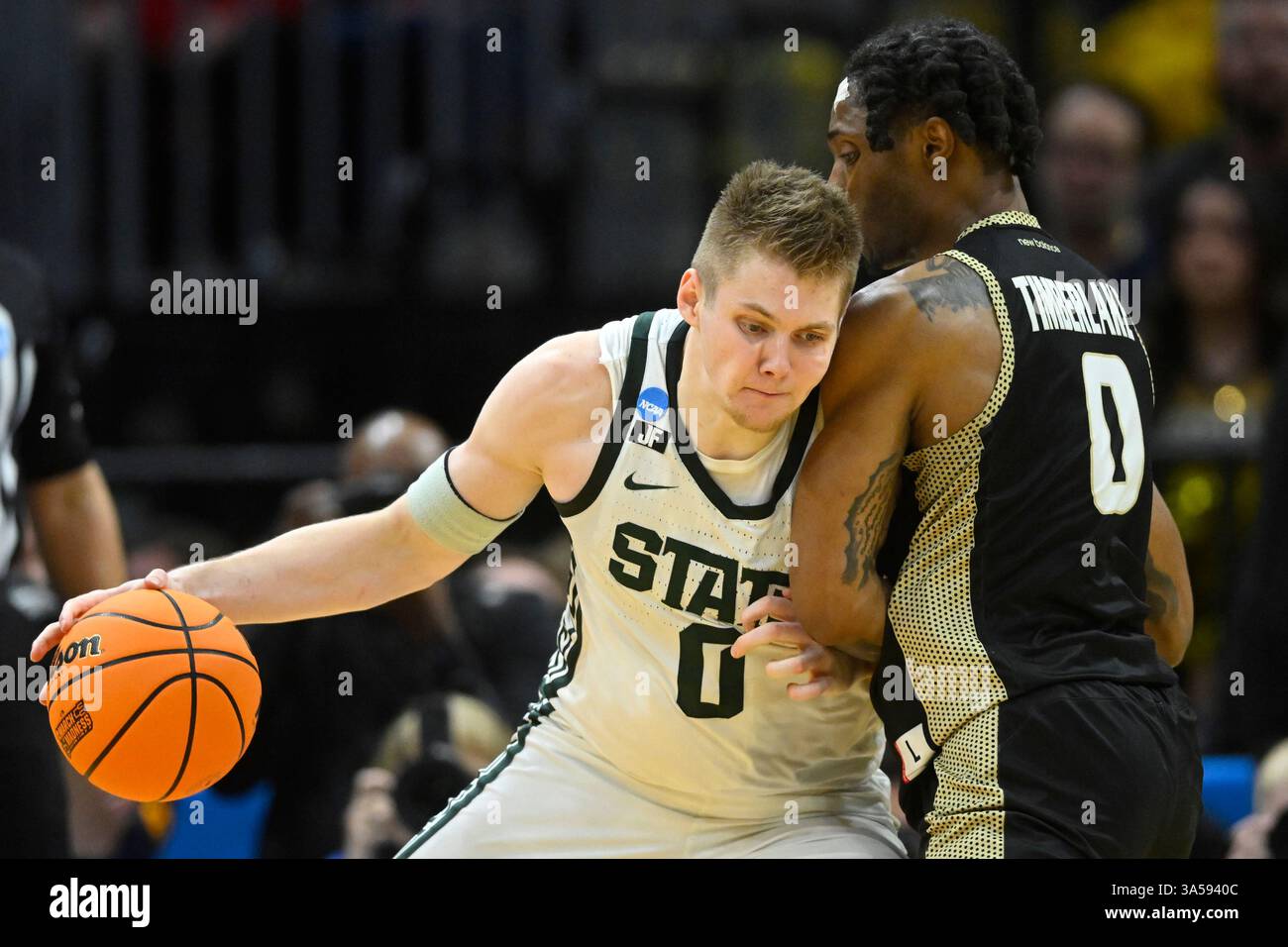 Michigan State forward Jaxon Kohler, left, dribble beside Bryant guard ...