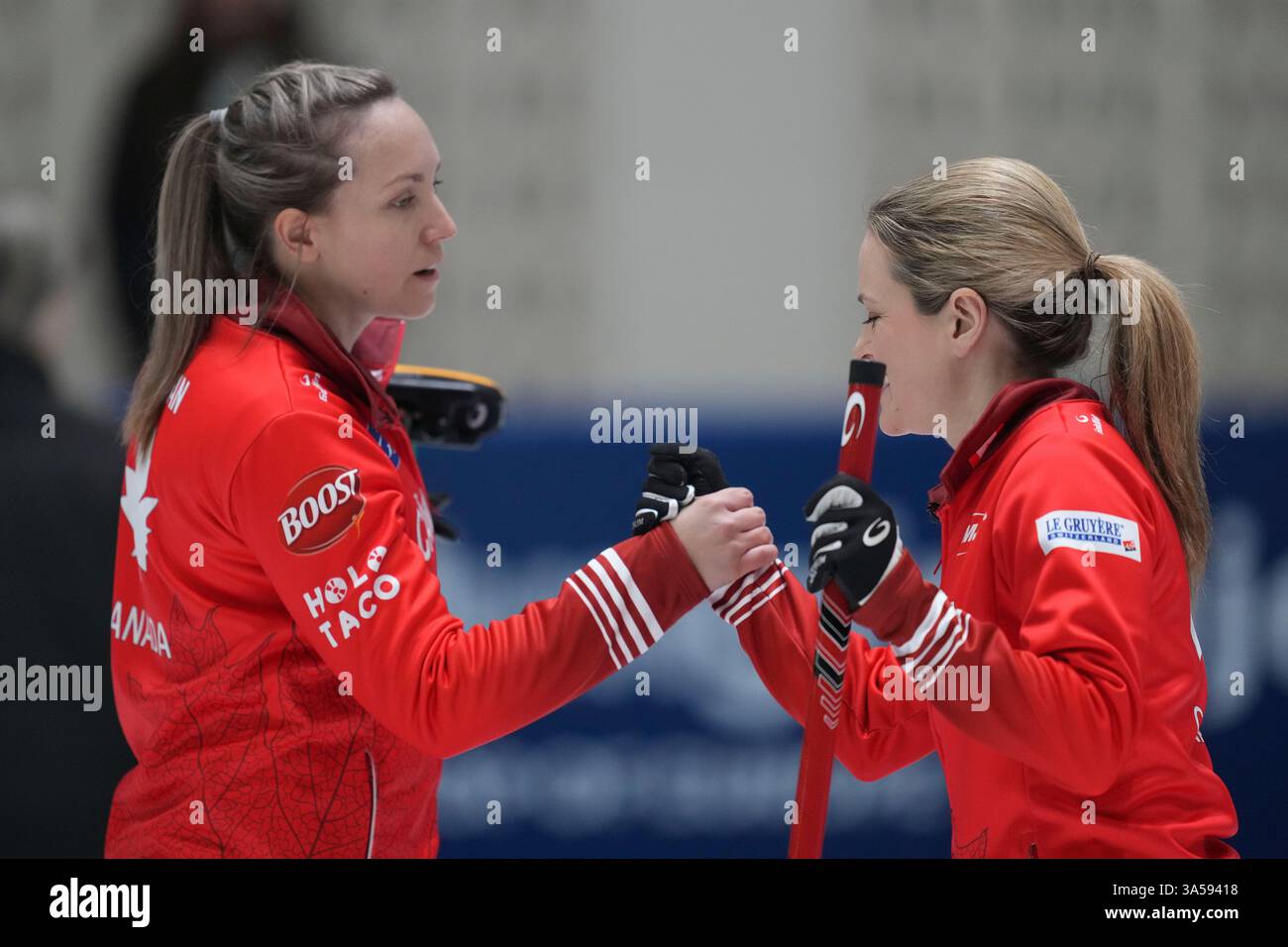 Canada's skip Rachel Homan, left, holds hands with Tracy Fleury, right ...