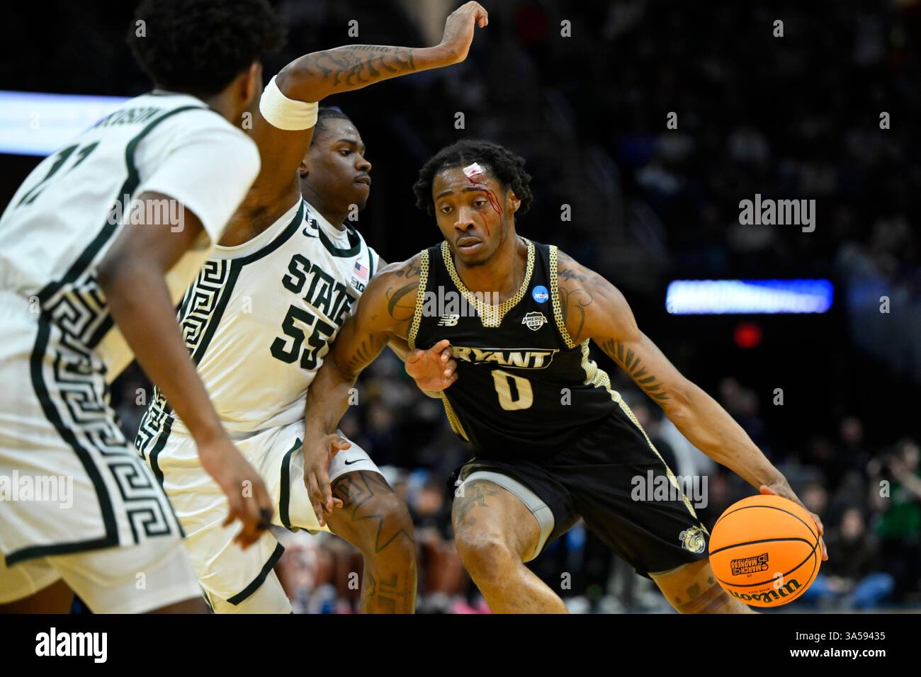 Michigan State forward Coen Carr (55) defends Bryant guard Earl ...