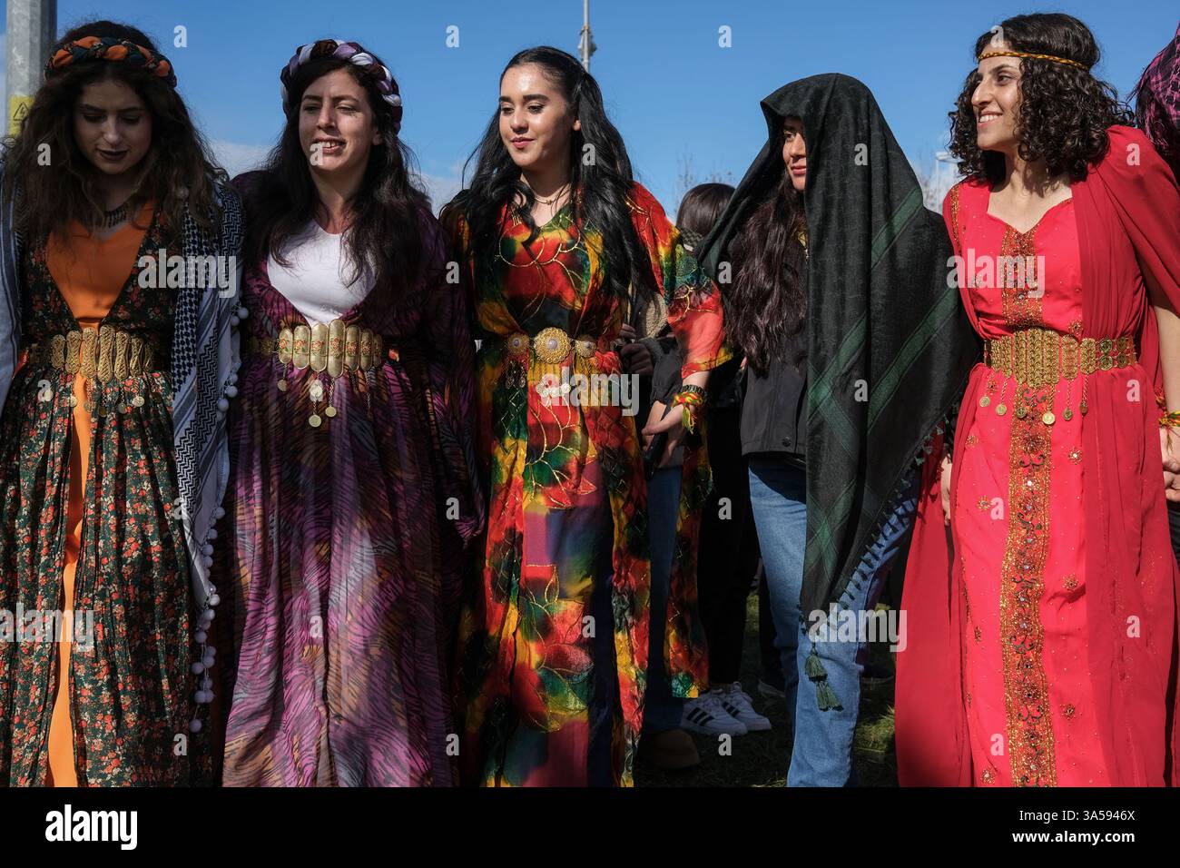 Diyarbakir, Turkey. 21st Mar, 2025. Women in traditional attire are ...