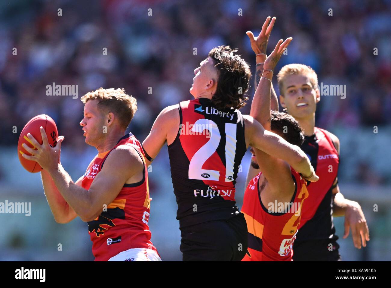 Mitch Hinge of the Crows (left) marks the footy during the AFL Round 2 ...