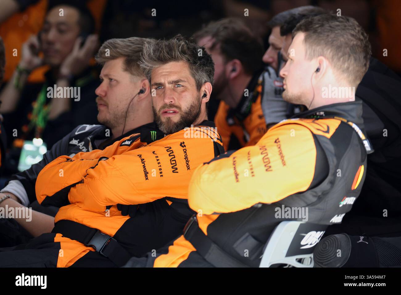 McLaren mechanics sit inside garage during the sprint race ahead of the ...