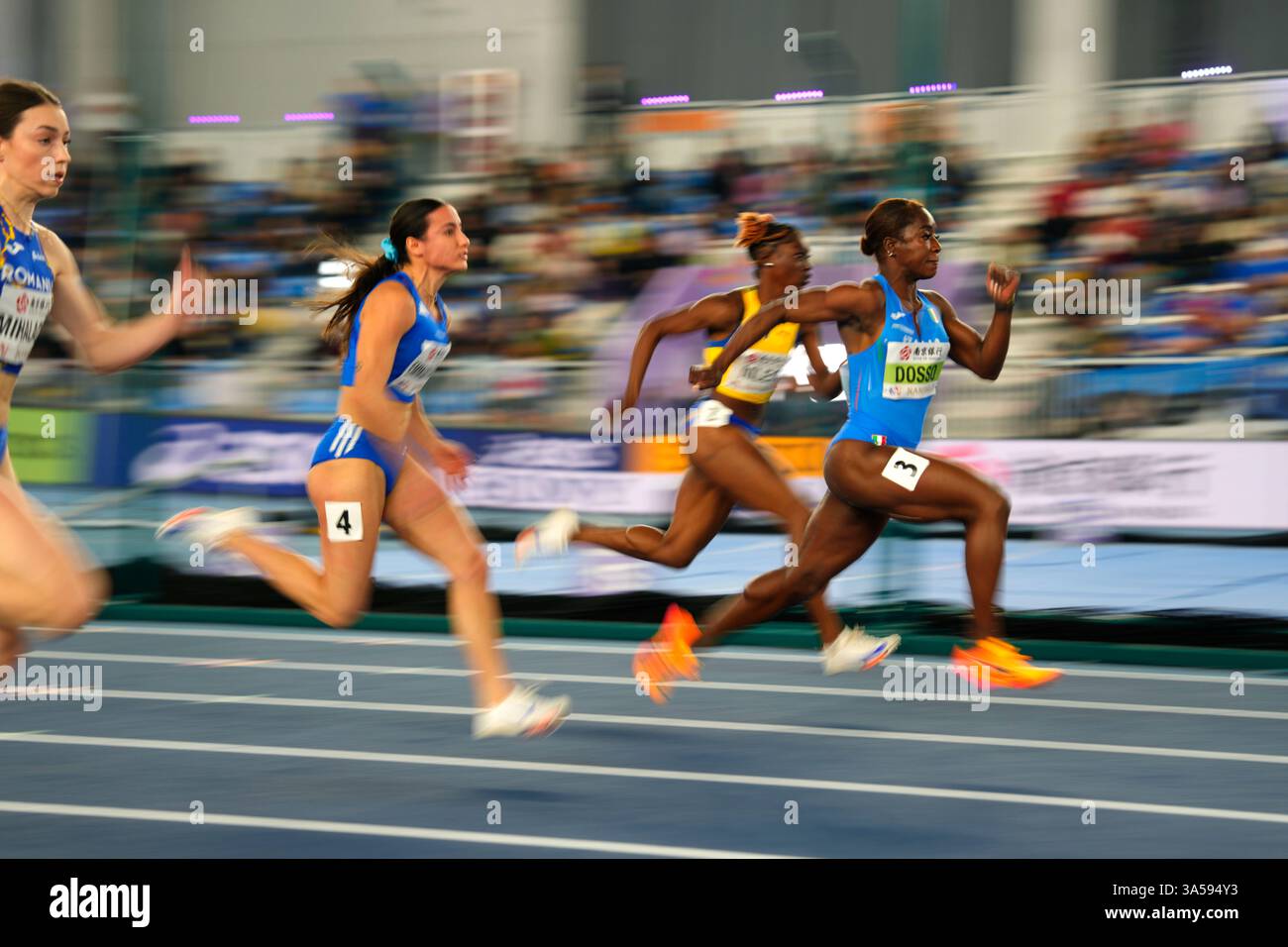 Zaynab Dosso, of Italy, right, leads in the in the women's 60 meters ...
