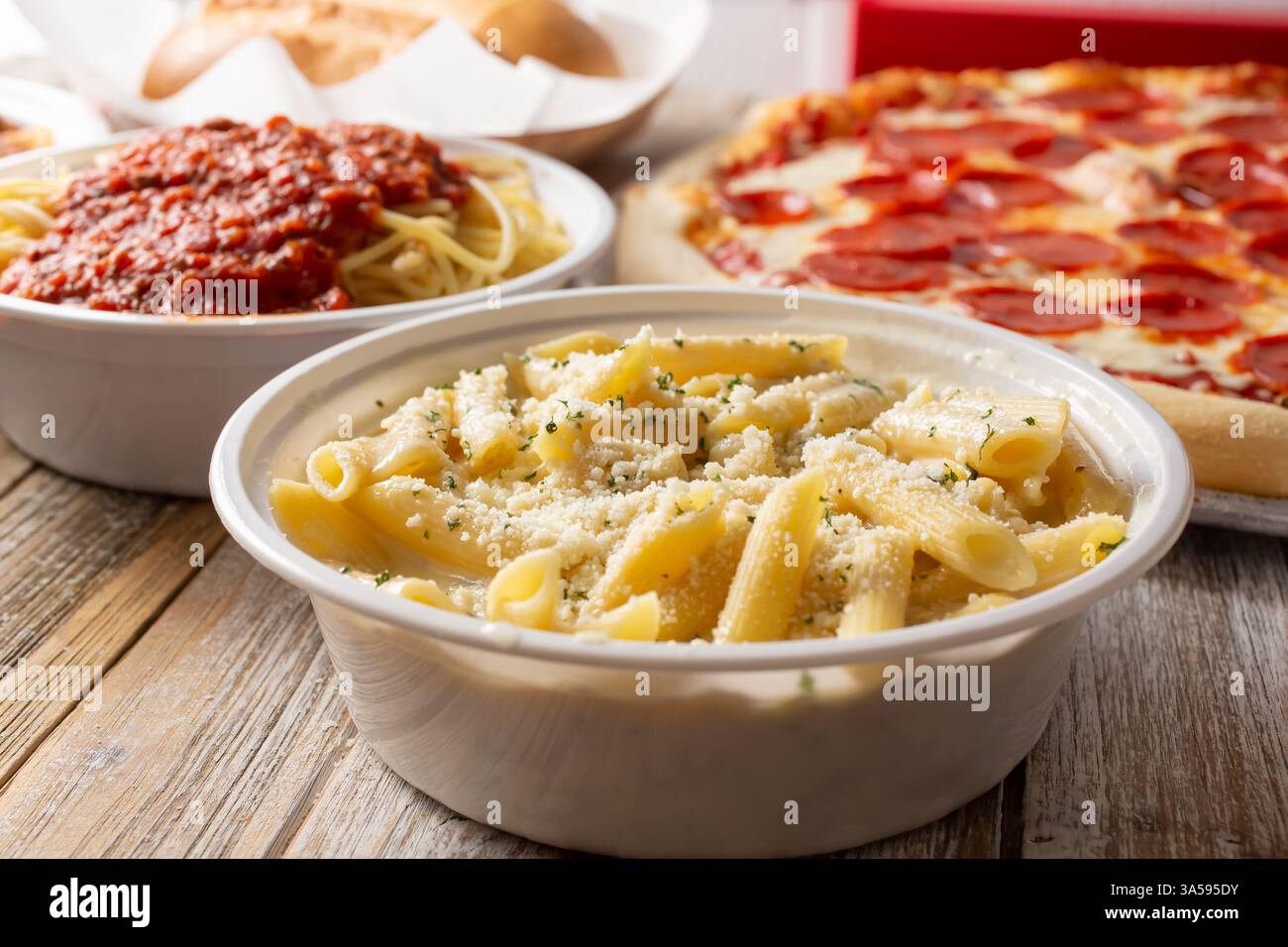 A view of several prepared Italian restaurant entrees Stock Photo - Alamy