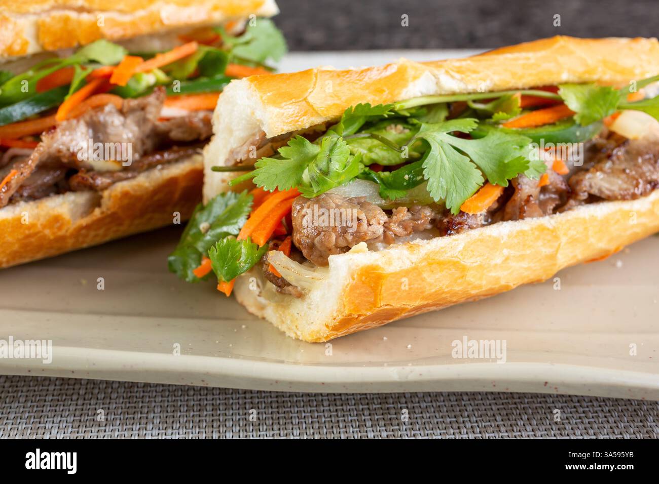 A closeup view of a teriyaki beef banh mi Vietnamese sandwich Stock ...