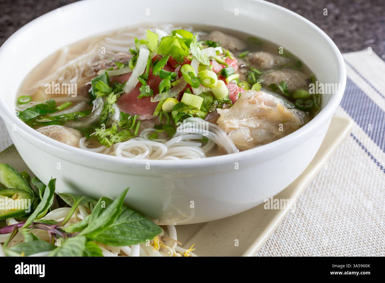 A view of a bowl of pho dac biet Stock Photo - Alamy