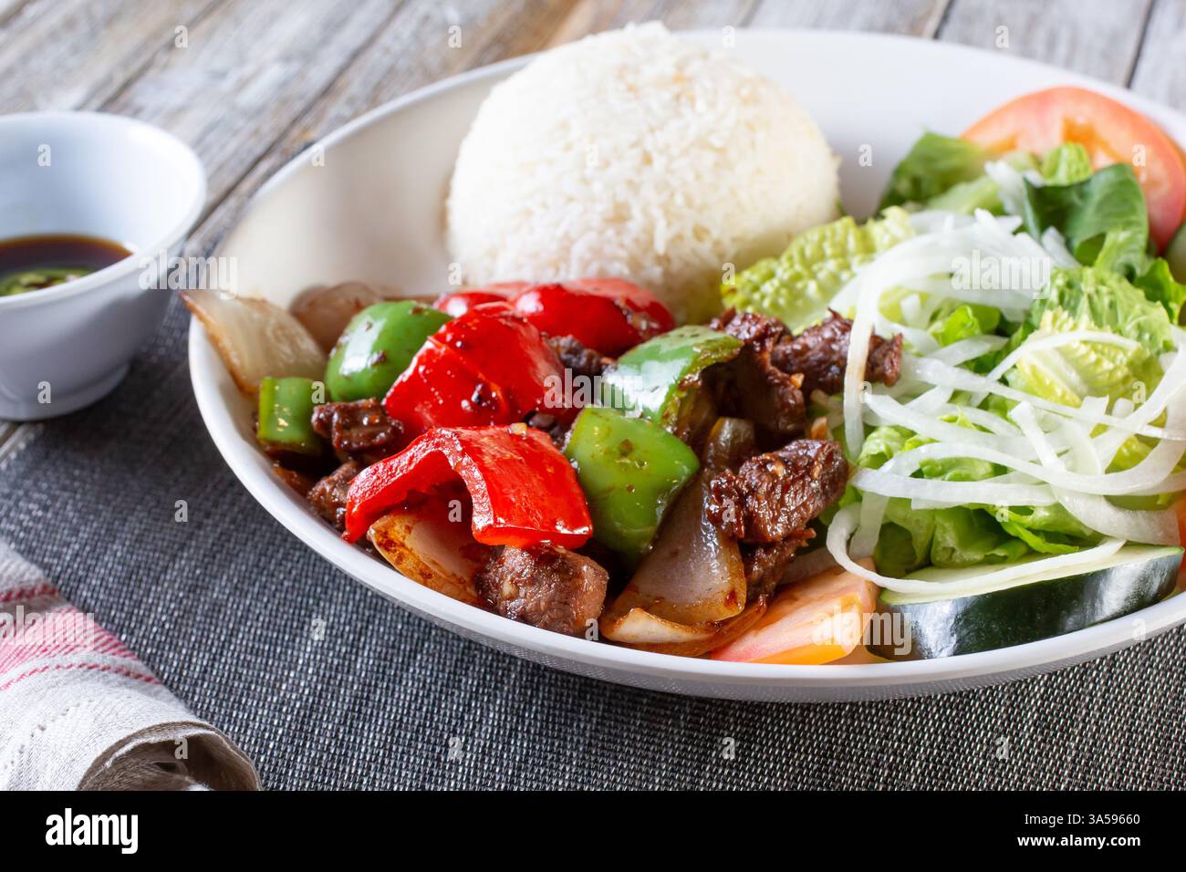 A view of a plate of shaking beef Stock Photo - Alamy