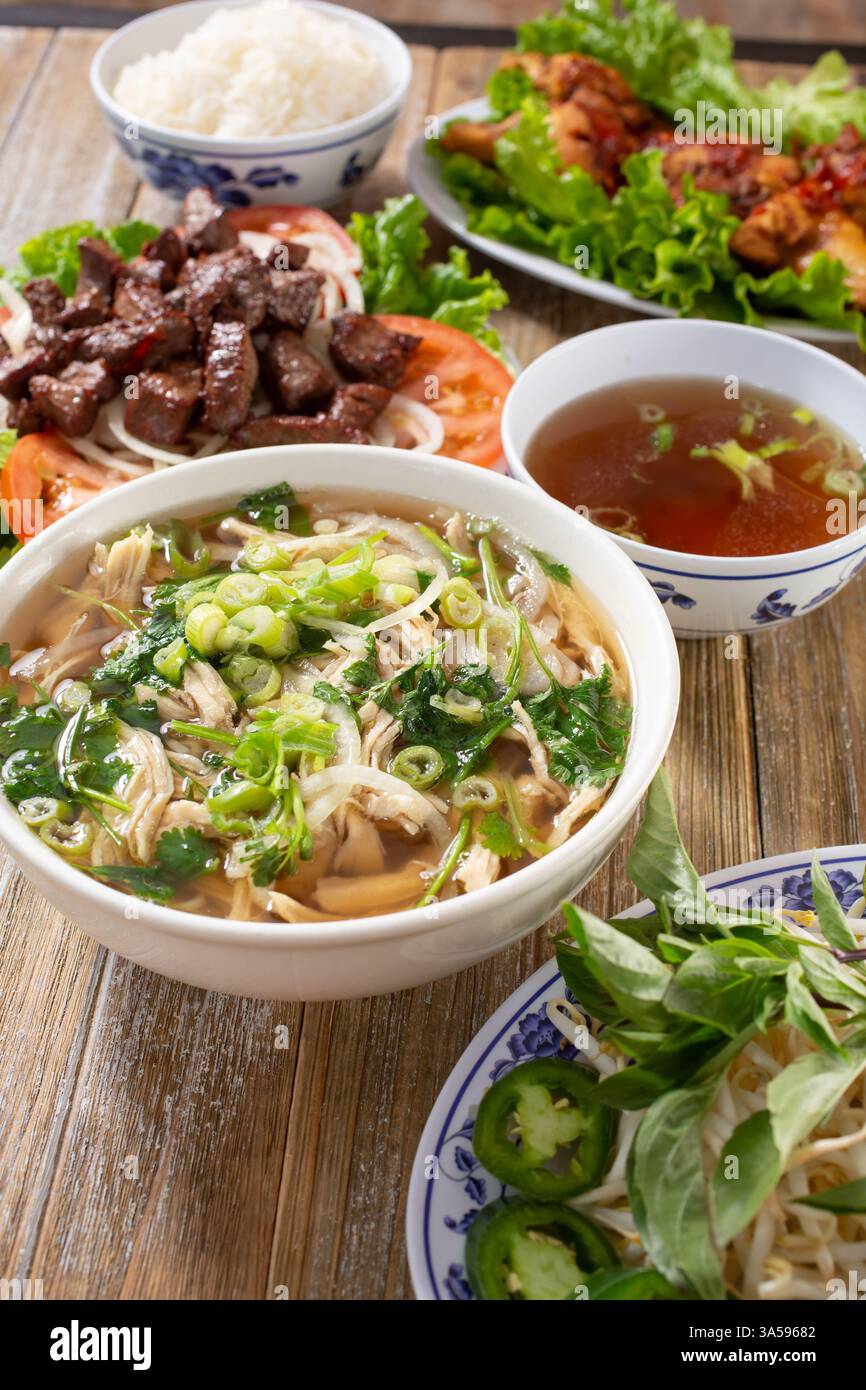 A view of an array of Vietnamese entree, featuring pho, shaking beef ...