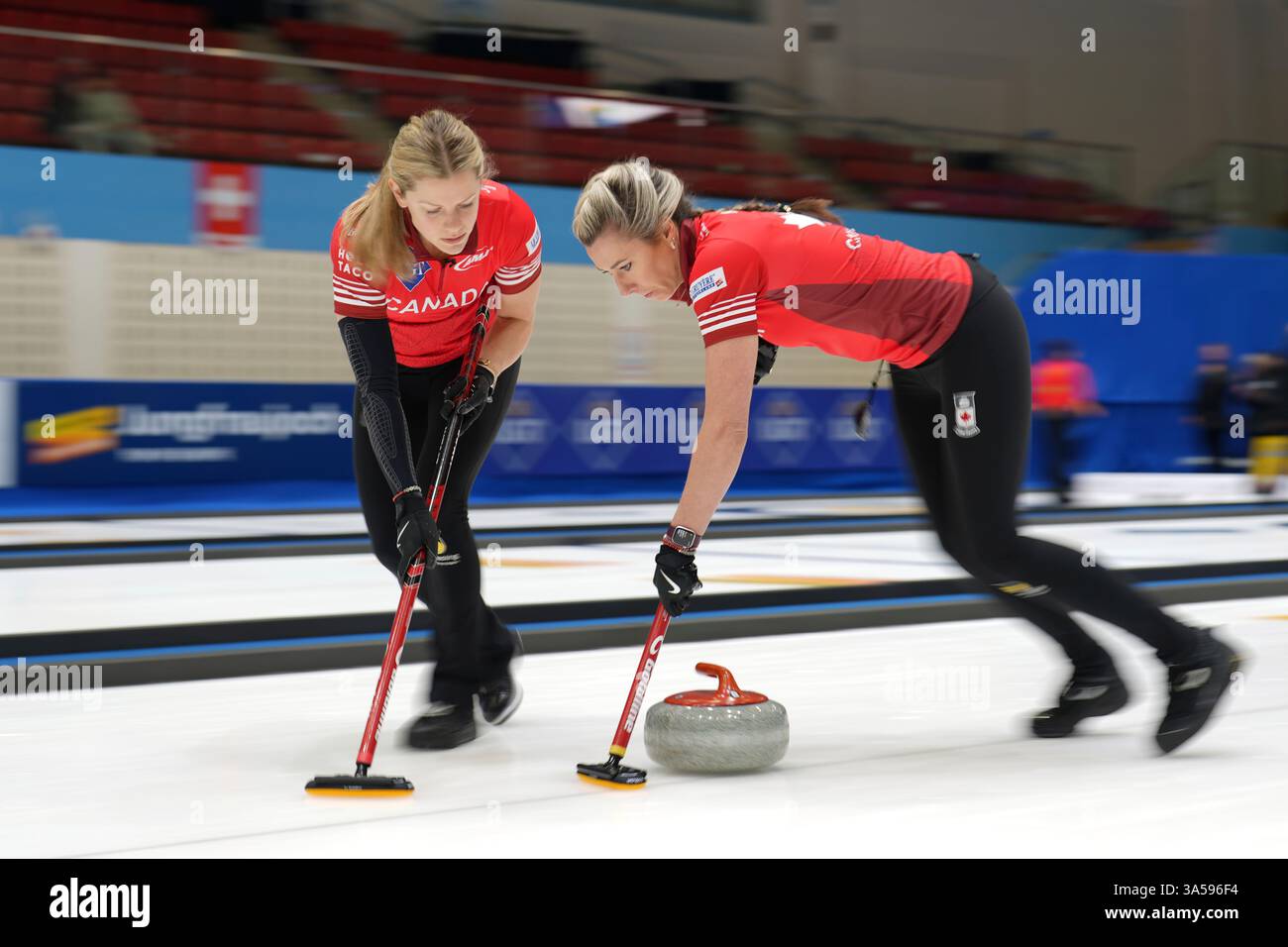 Canada's Emma Miskew, right, and Sarah Wilkes, left, sweep during the ...
