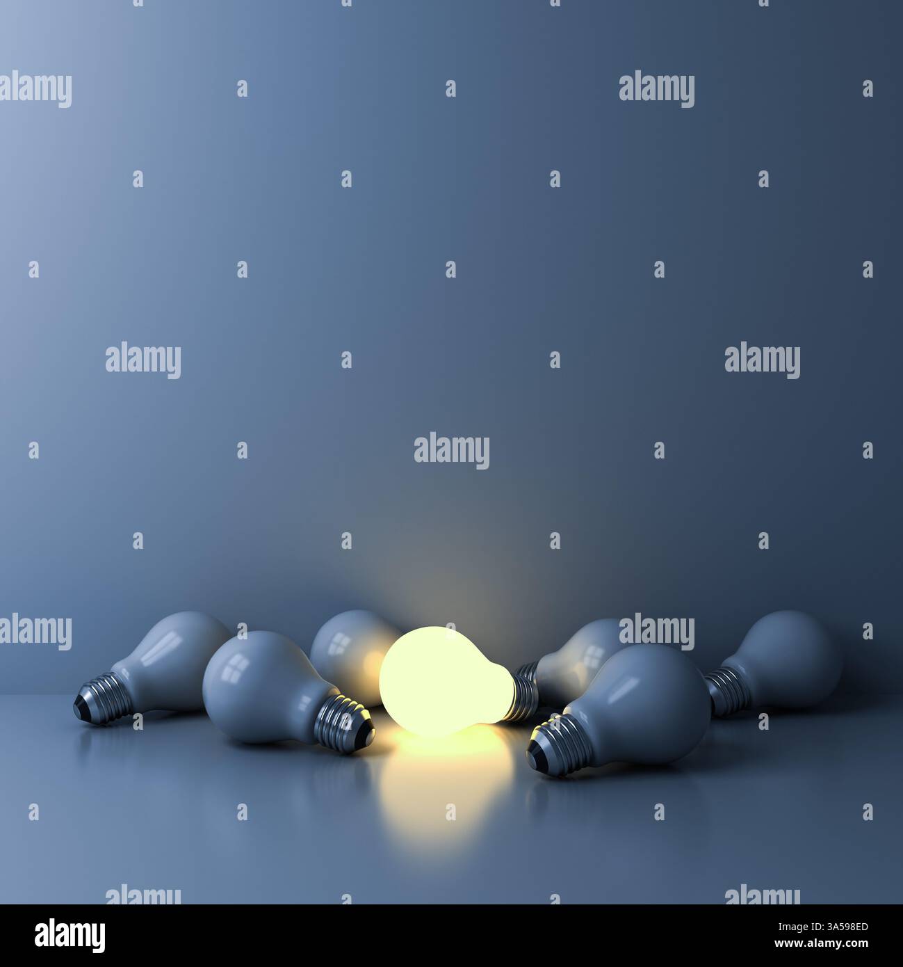 One glowing light bulb among the unlit incandescent bulbs or stand out ...