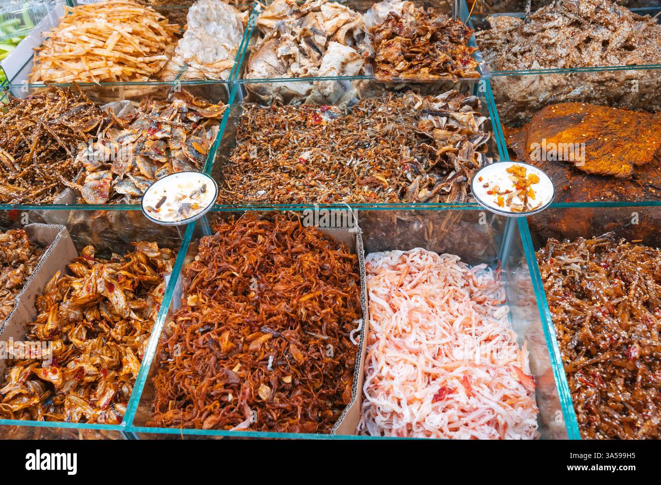 dried fish and seafood for snacks at the Asian fish market Stock Photo ...