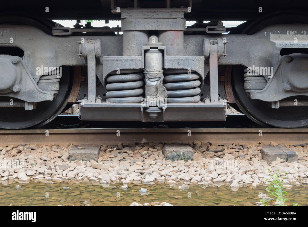 Zoom train suspension of a Public Thai Train Railway Stock Photo - Alamy