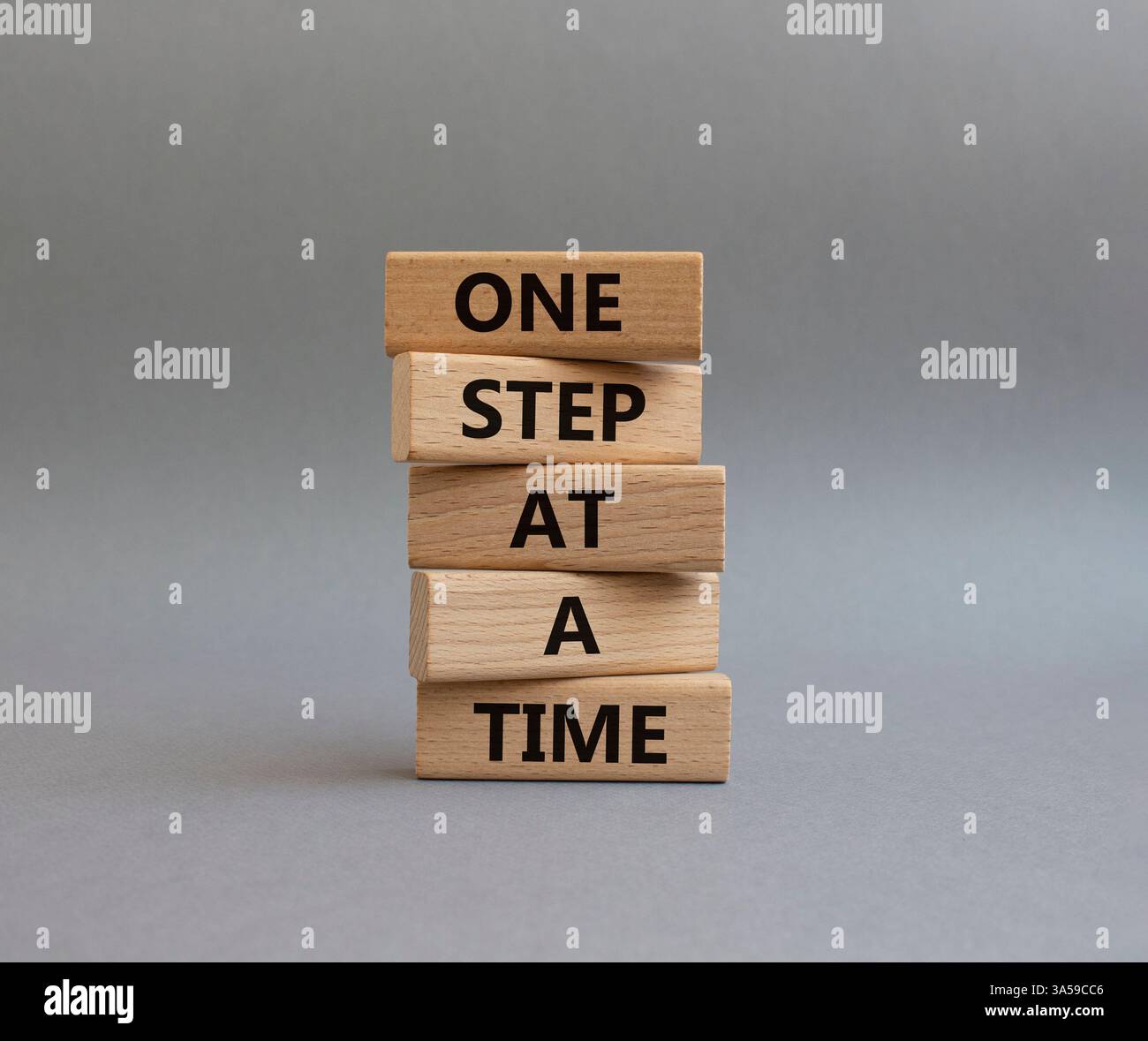 One step at a time symbol. Concept words One step at a time on wooden ...
