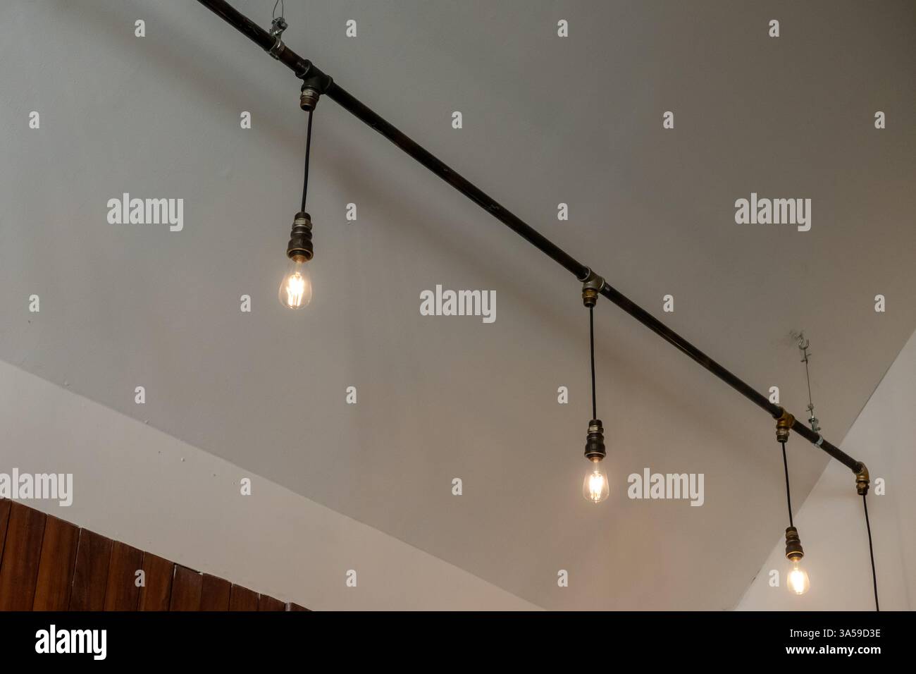 Hanging Edison light bulb on the ceiling, also known as filament light ...
