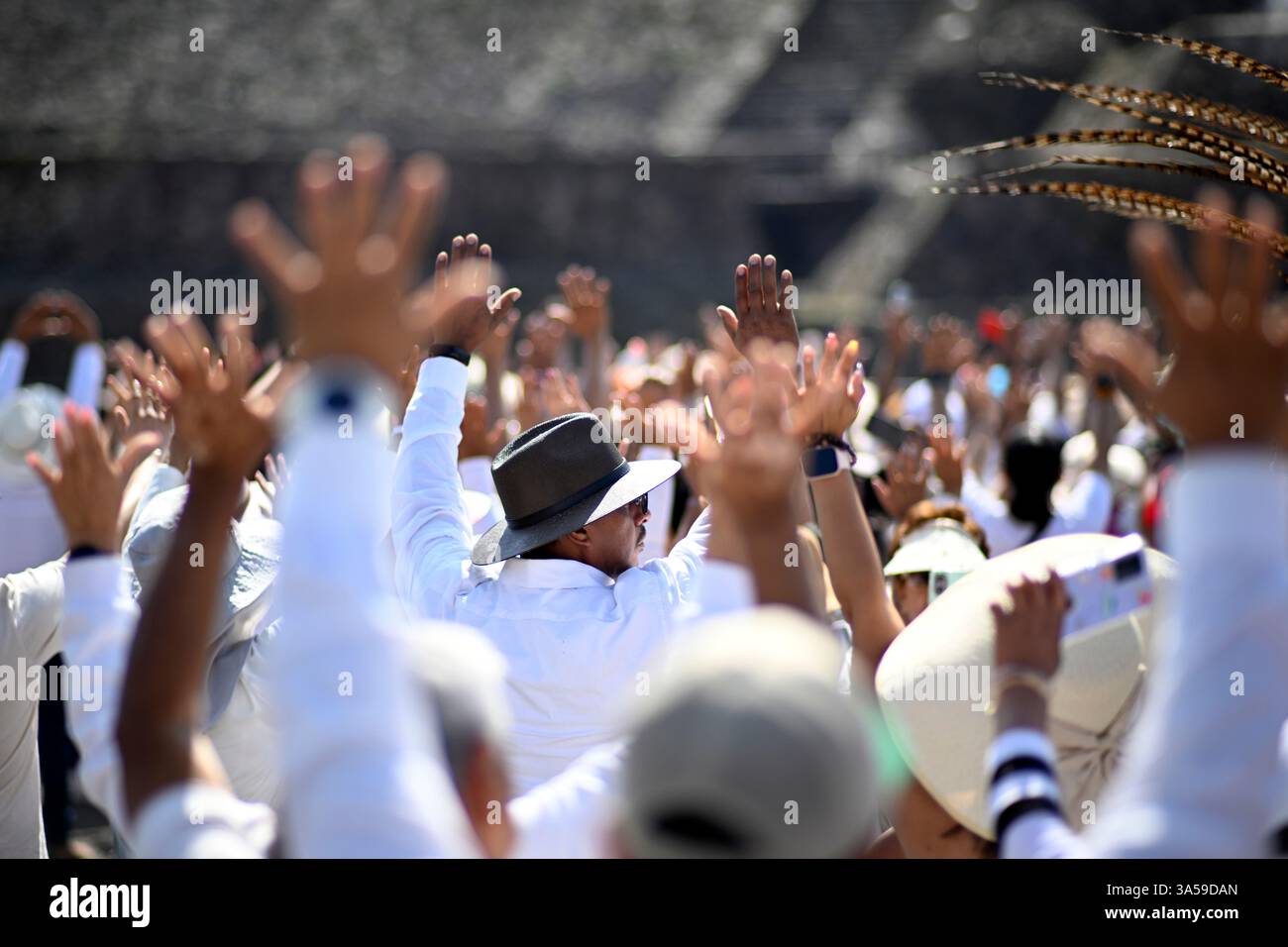 Teotihuacan, Mexico. 21st Mar, 2025. People bask in the sunshine during ...
