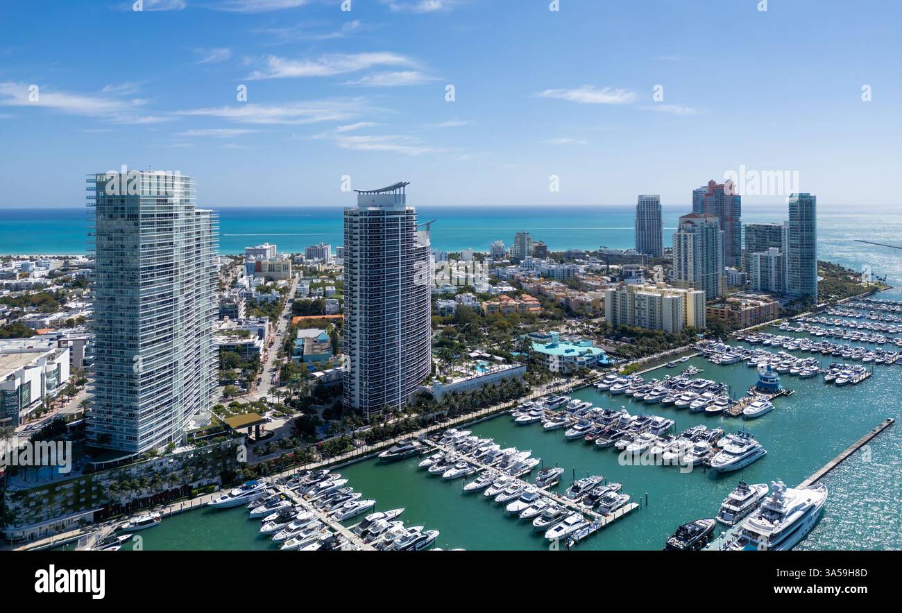 Luxury yacht cruising on Miamis coastline. Aerial view of yachts docked ...
