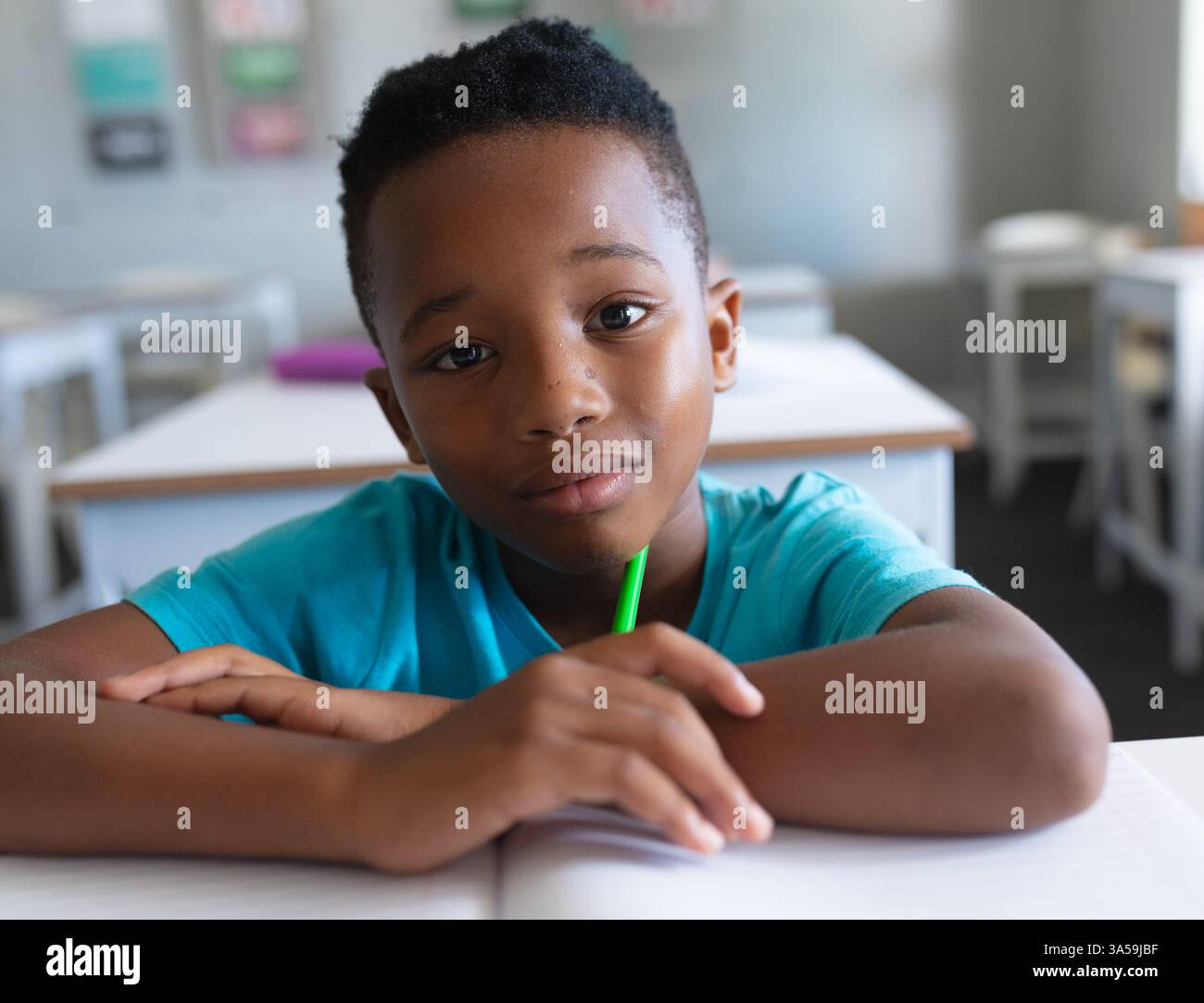 African american boy holding pencil hi-res stock photography and images ...