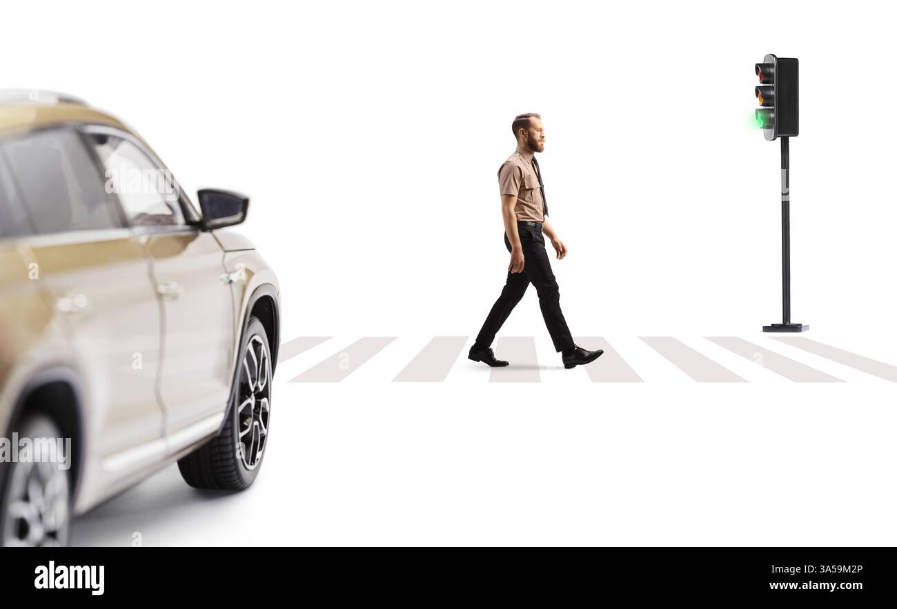 Full length profile shot of a security officer crossing street at green ...