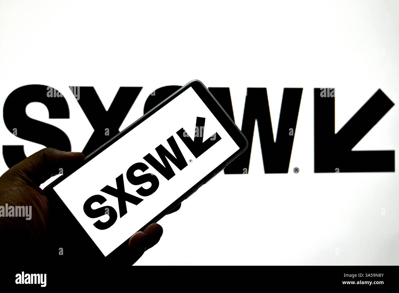 In this photo illustration, a SXSW logo is seen displayed on a ...