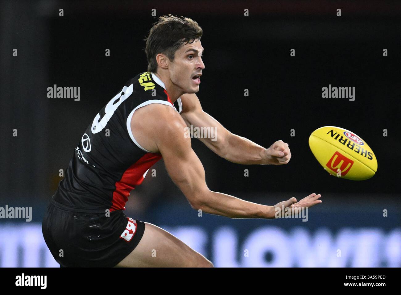 Jack Steele of St Kilda handballs during the AFL Round 2 match between ...
