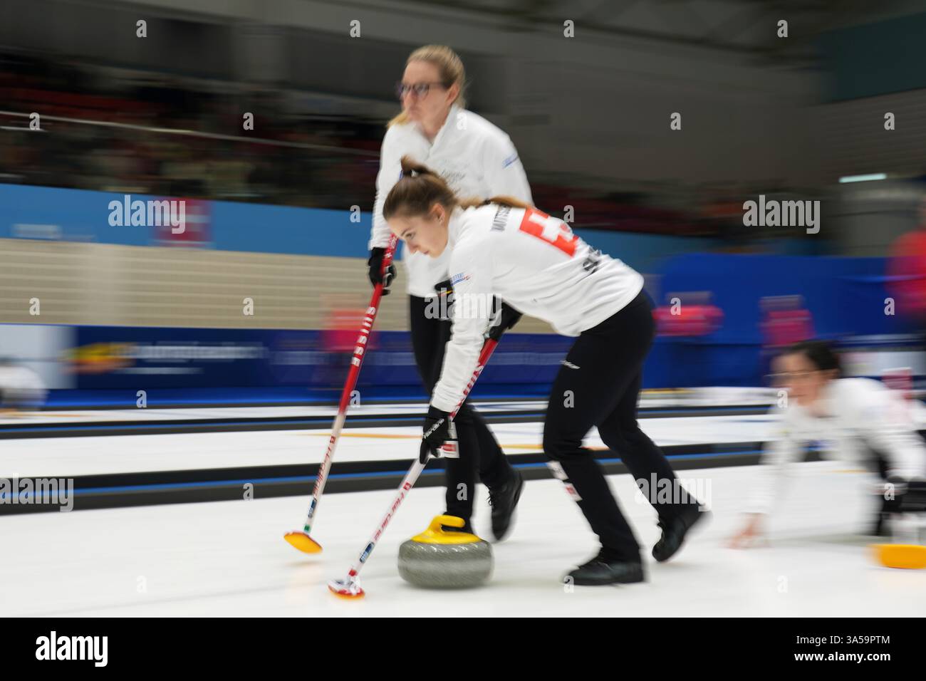 Switzerland's Alina Paetz and Selina Witschonke sweep during the ...