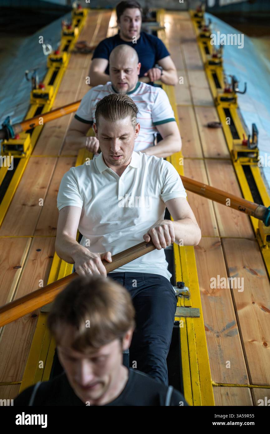 Top view exhausted determined rowers push limits training intensely on ...