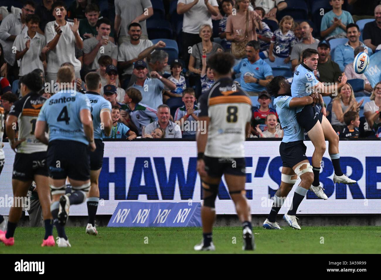 Teddy Wilson of the Waratahs celebrates after scoring a try during the ...