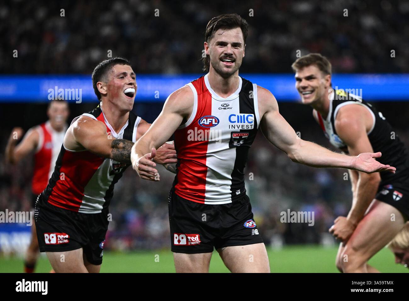 Jack Sinclair of St Kilda (centre) celebrates scoring a goal during the ...